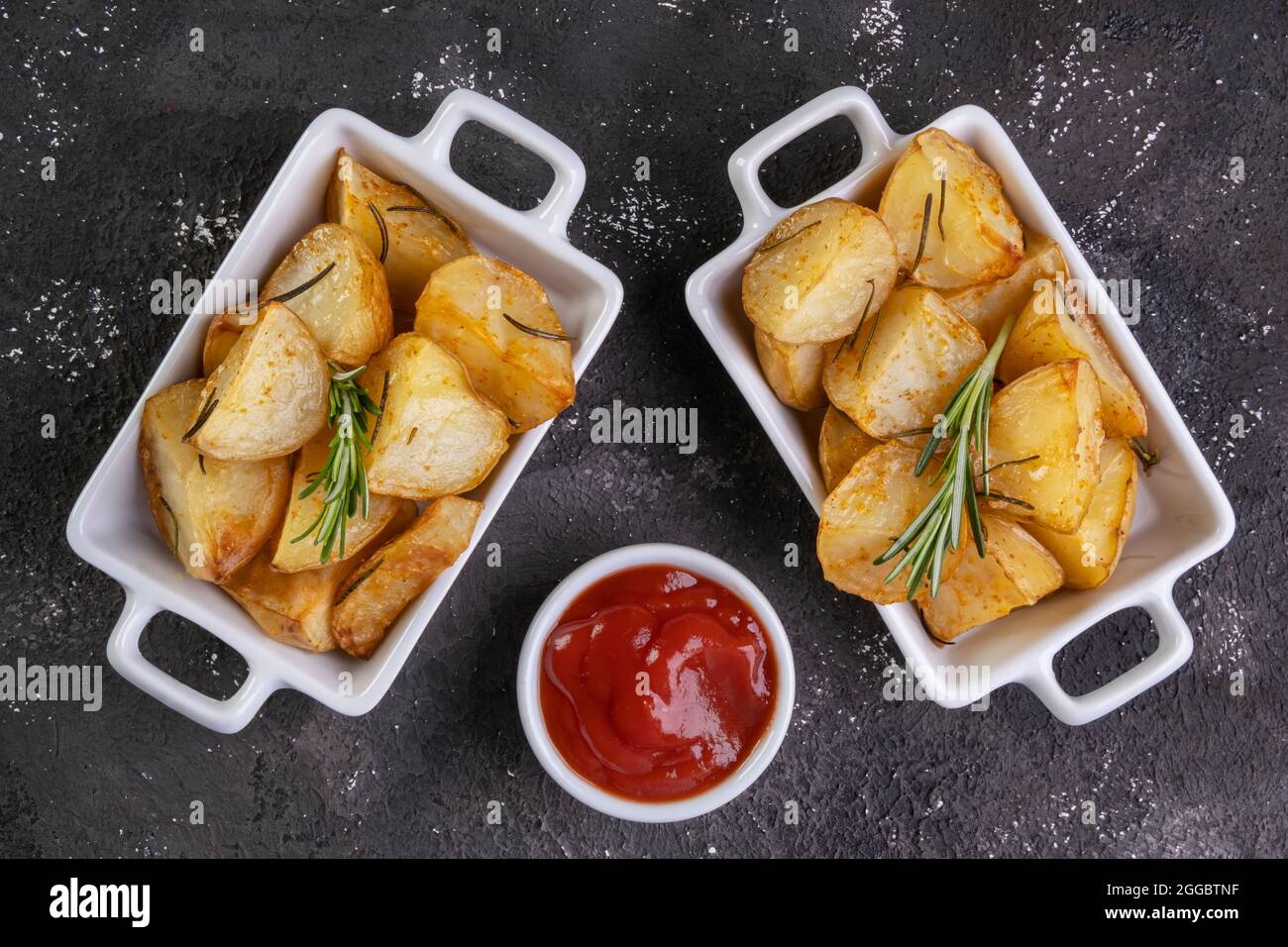 bowl of rustic fried and roasted potatoes with rosemary Stock Photo - Alamy