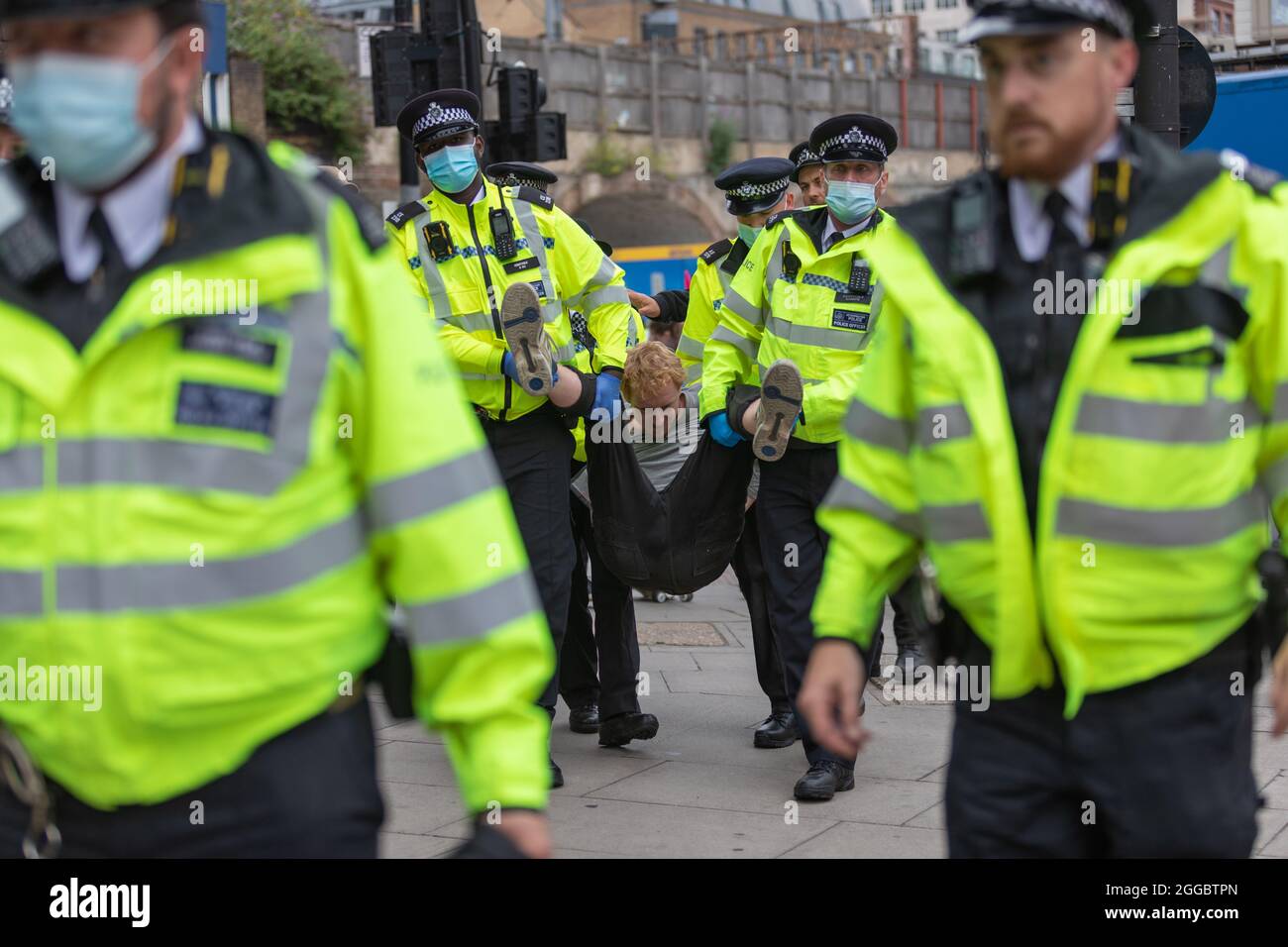 London, UK. 30th Aug 2021. A large police presence at Tower Bridge as ...