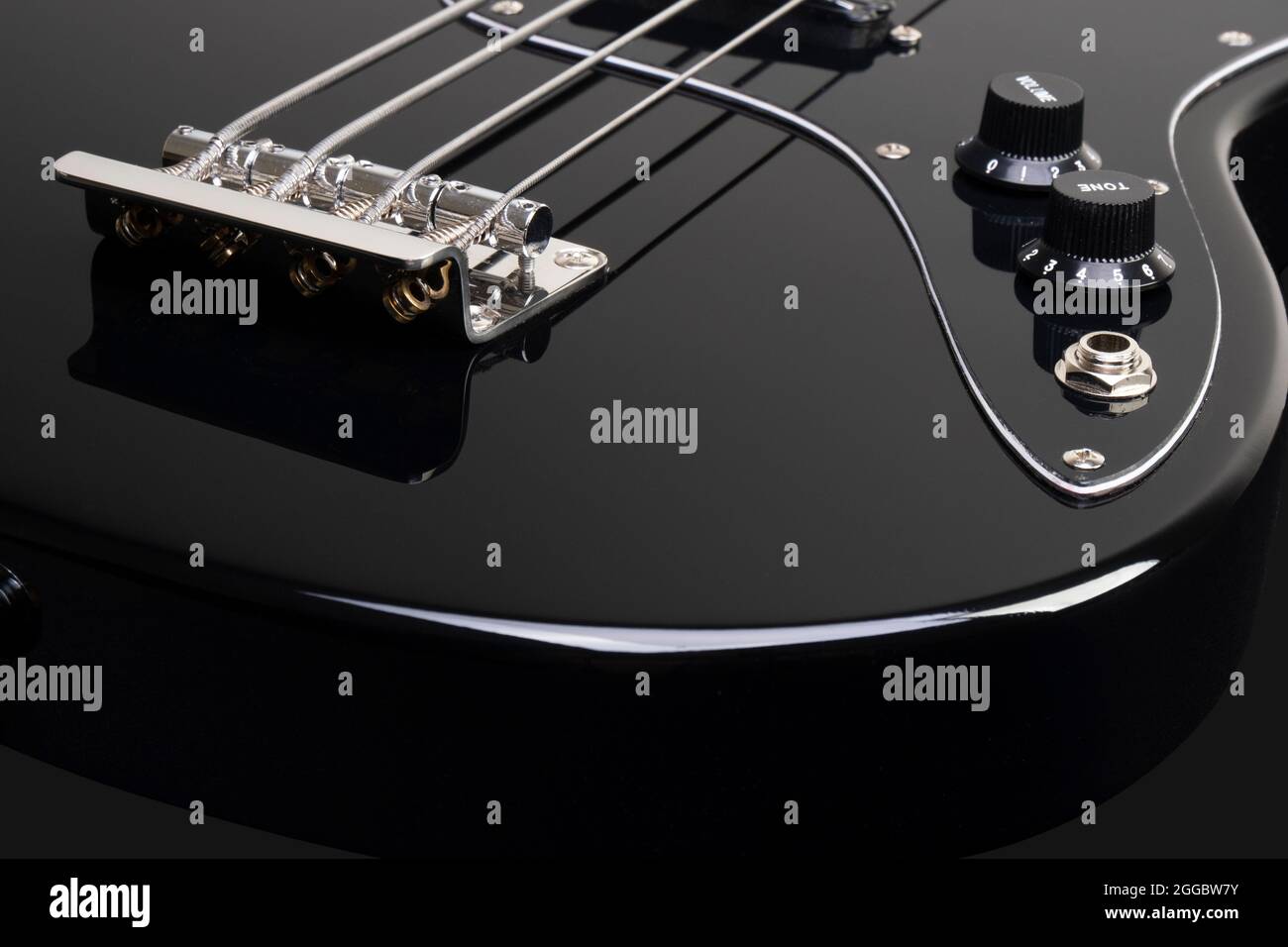 black bass guitar on black background Stock Photo - Alamy