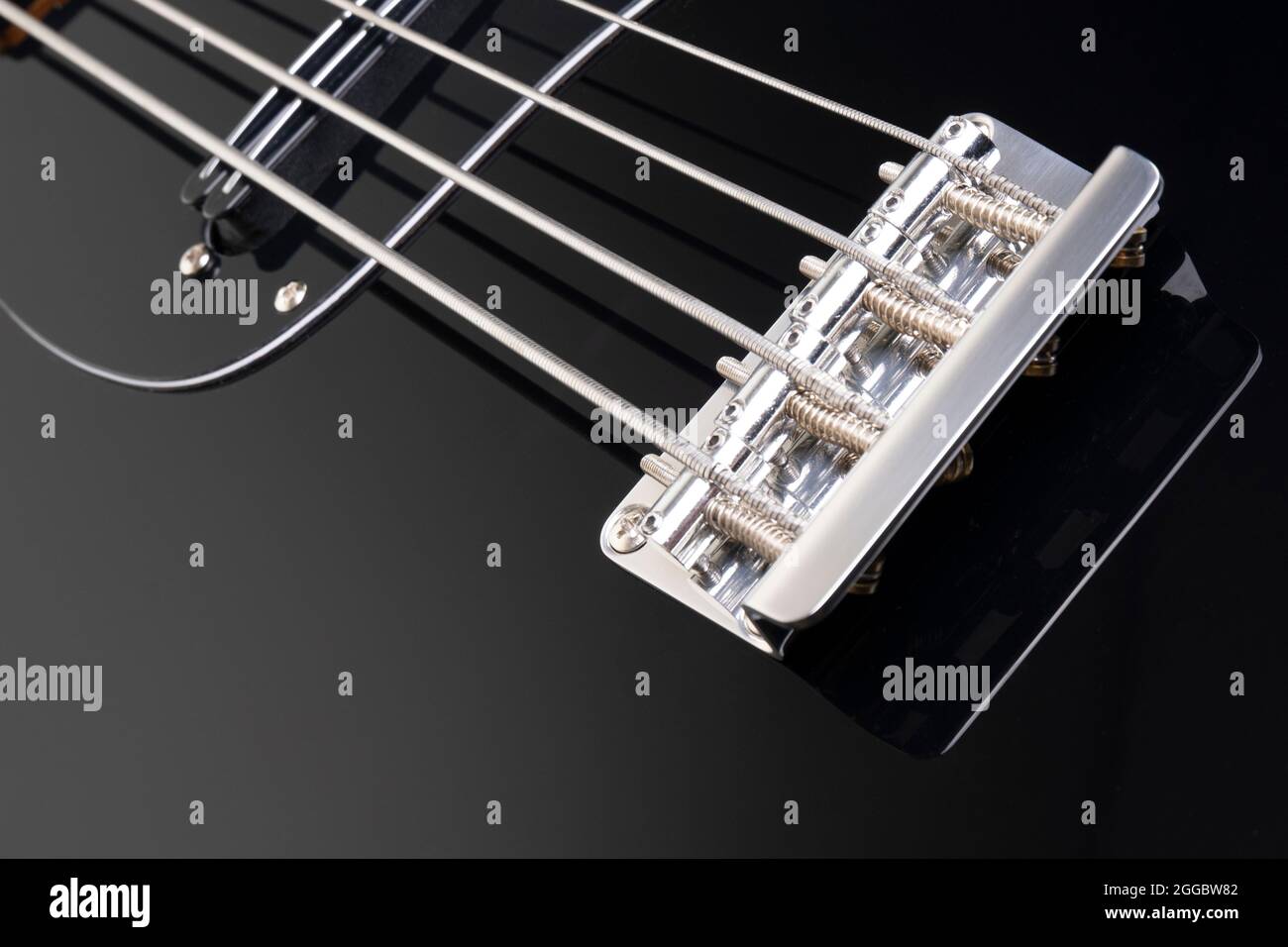black bass guitar on black background Stock Photo - Alamy