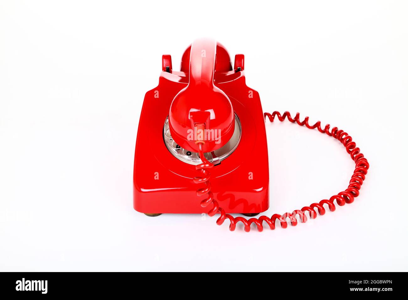 Vintage red GPO telephone with the handset incorrectly placed over the ...