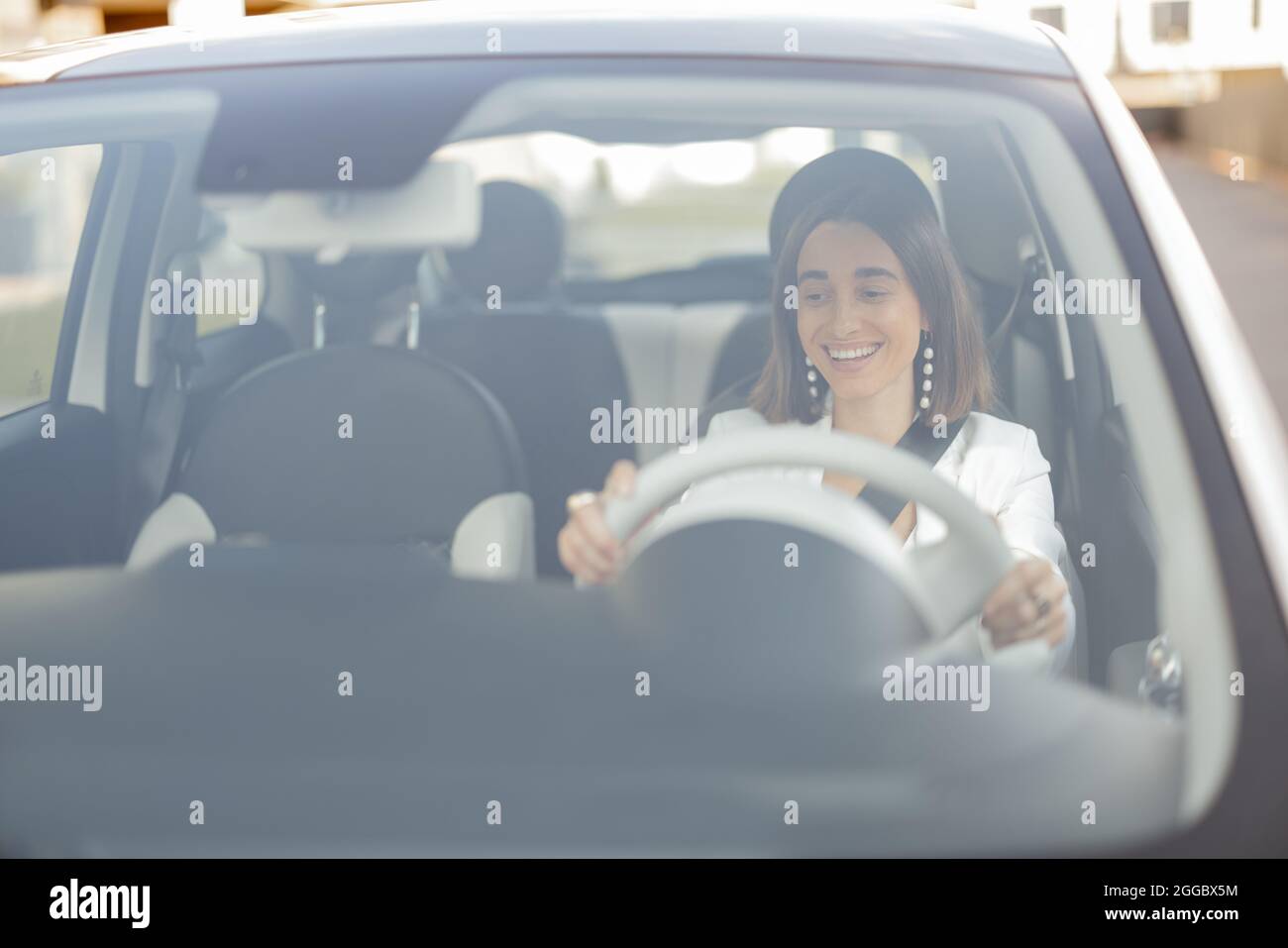 Business woman driving car Stock Photo - Alamy