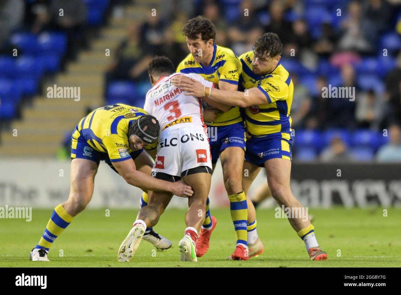 Kevin Naiqama (3) of St Helens is tackled by Stefan Ratchford (1 ...