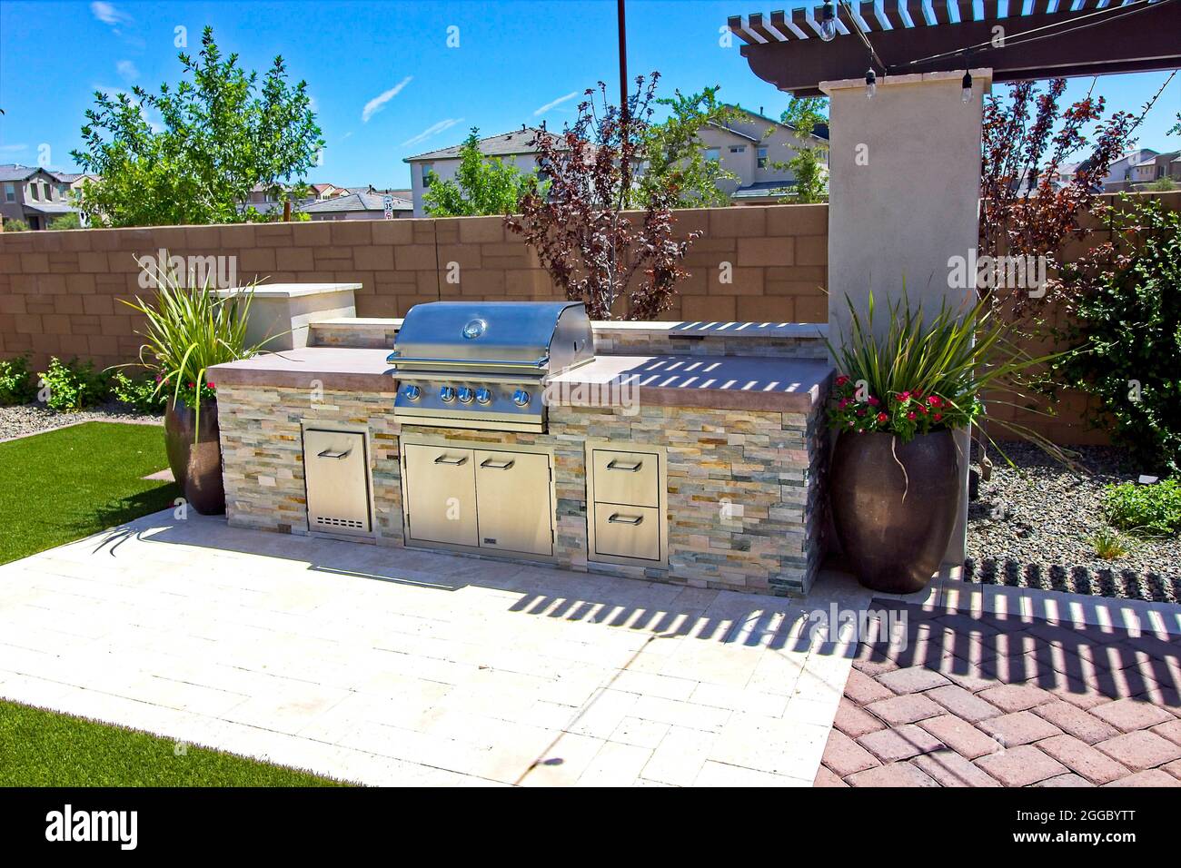 Built-In Stainless Steel BBQ In Back Yard BBQ Area Stock Photo - Alamy