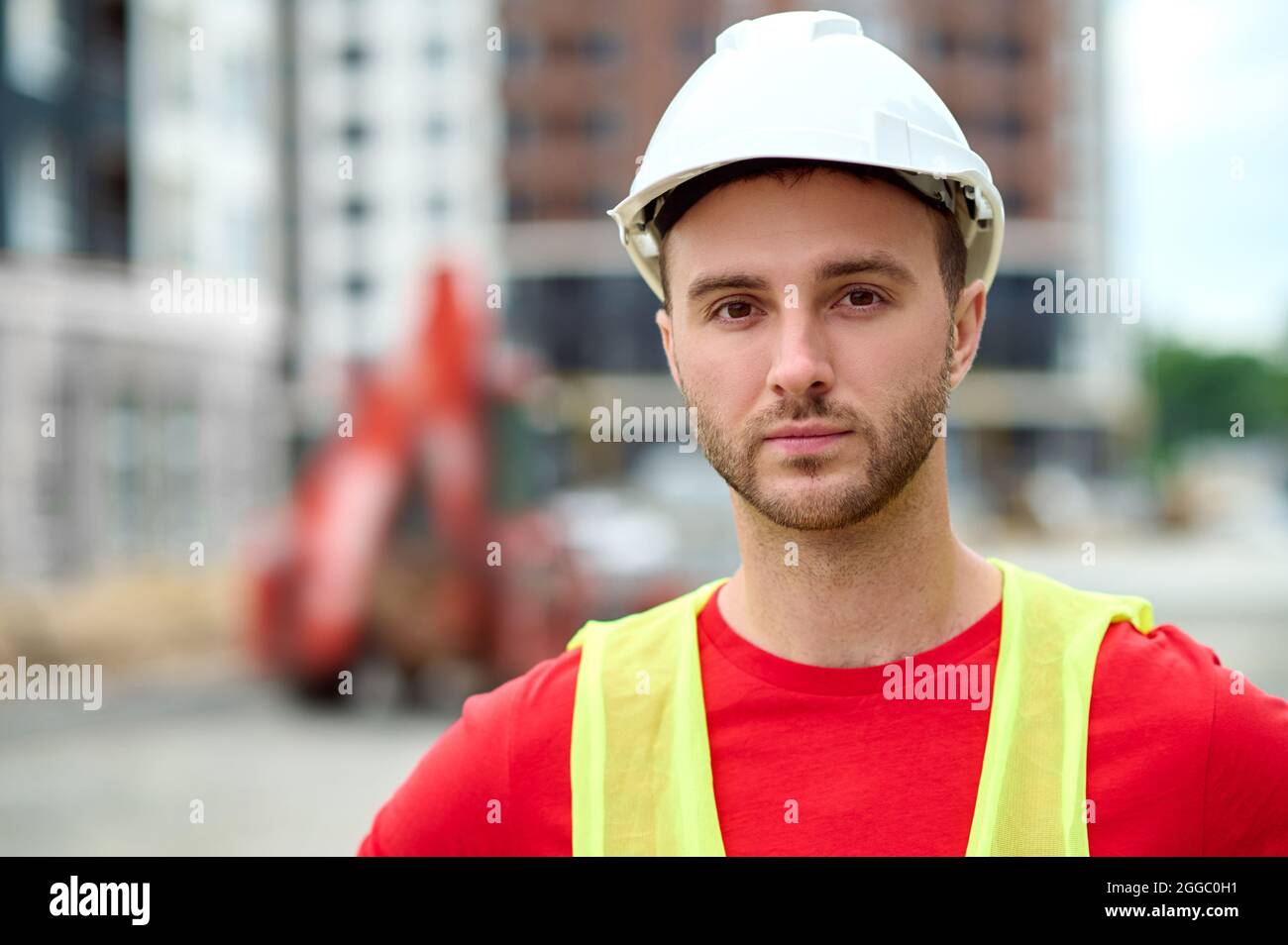 Young serious builder looking hi-res stock photography and images - Alamy