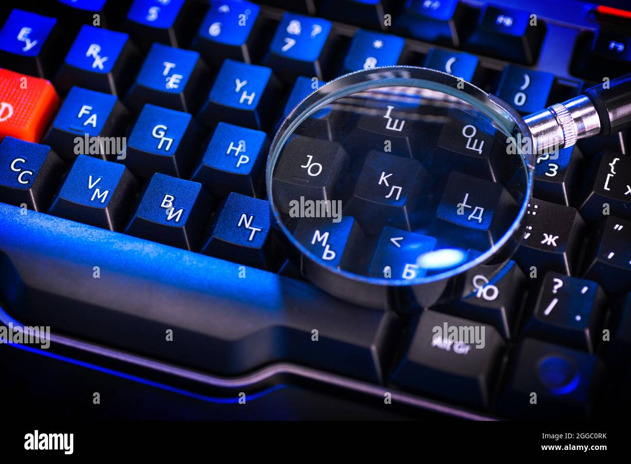 Magnifying glass on the keys of a black computer keyboard Stock Photo ...