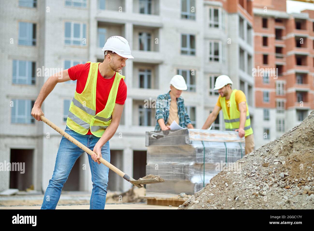 Hardworking Caucasian male builder working on the construction site ...