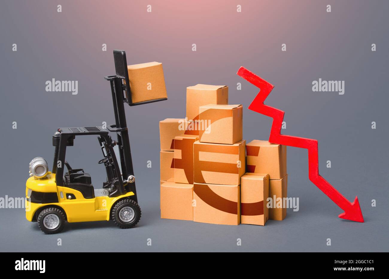 Goods boxes with Euro symbol and red down arrow. revenue drop in the ...