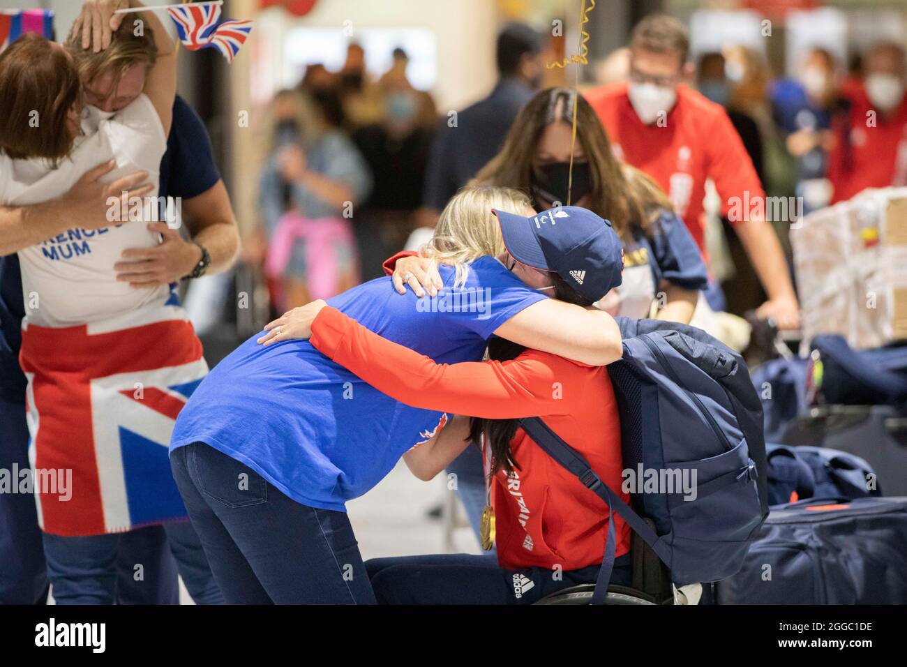 Gold medalist Lauren Rowles is welcomed by friends and family as she ...