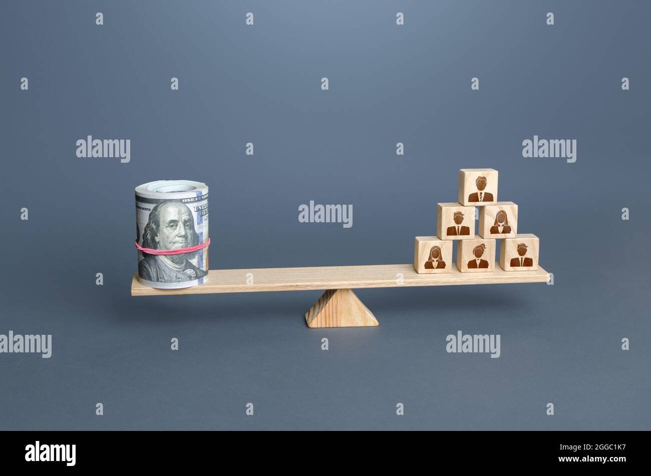 Money dollars and people on scales. Concept of wages for employees and ...