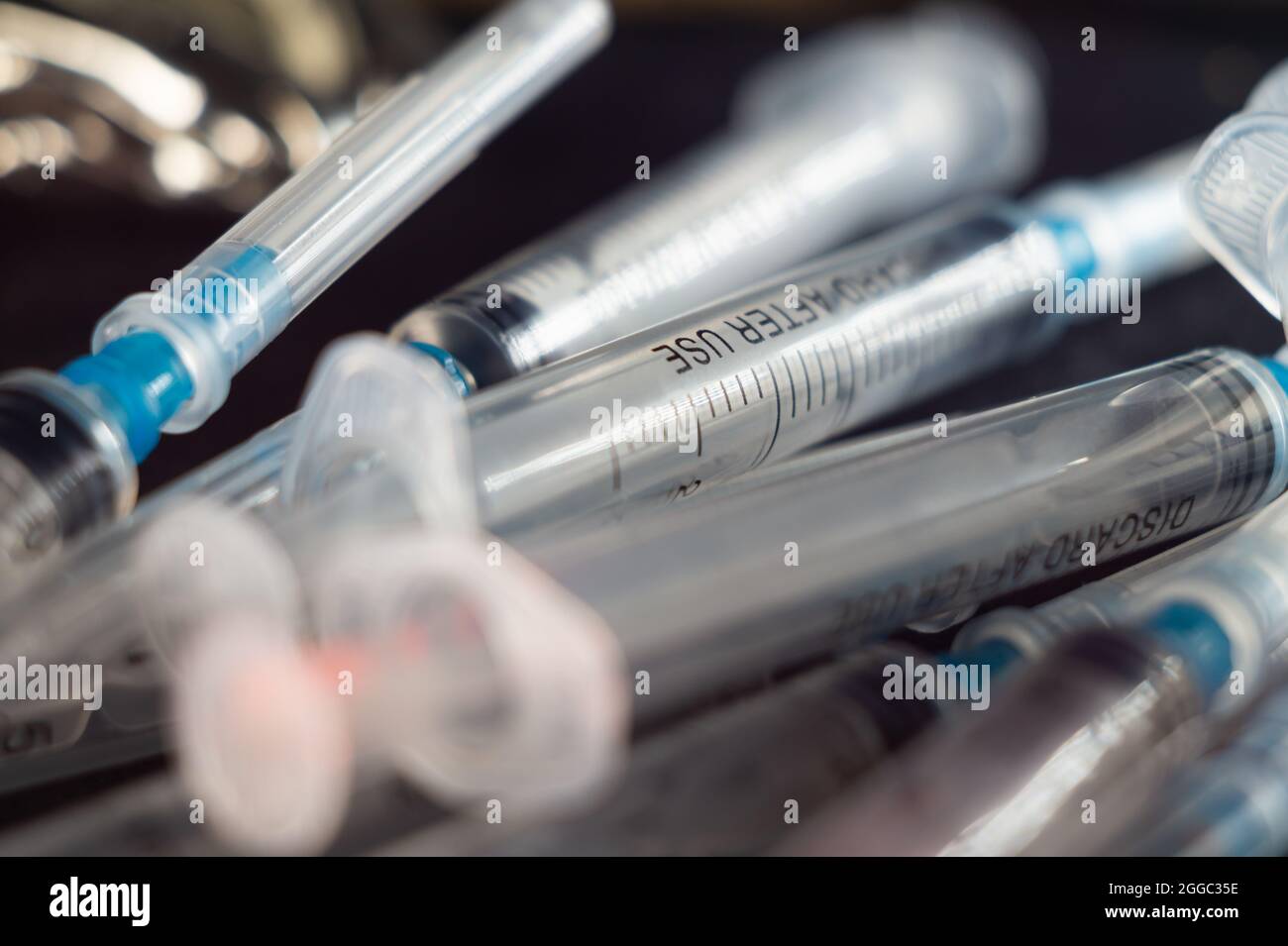 Closeup shot of several empty syringes with needles Stock Photo - Alamy