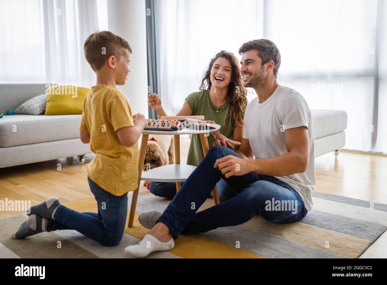 Happy family having fun time at home Stock Photo - Alamy