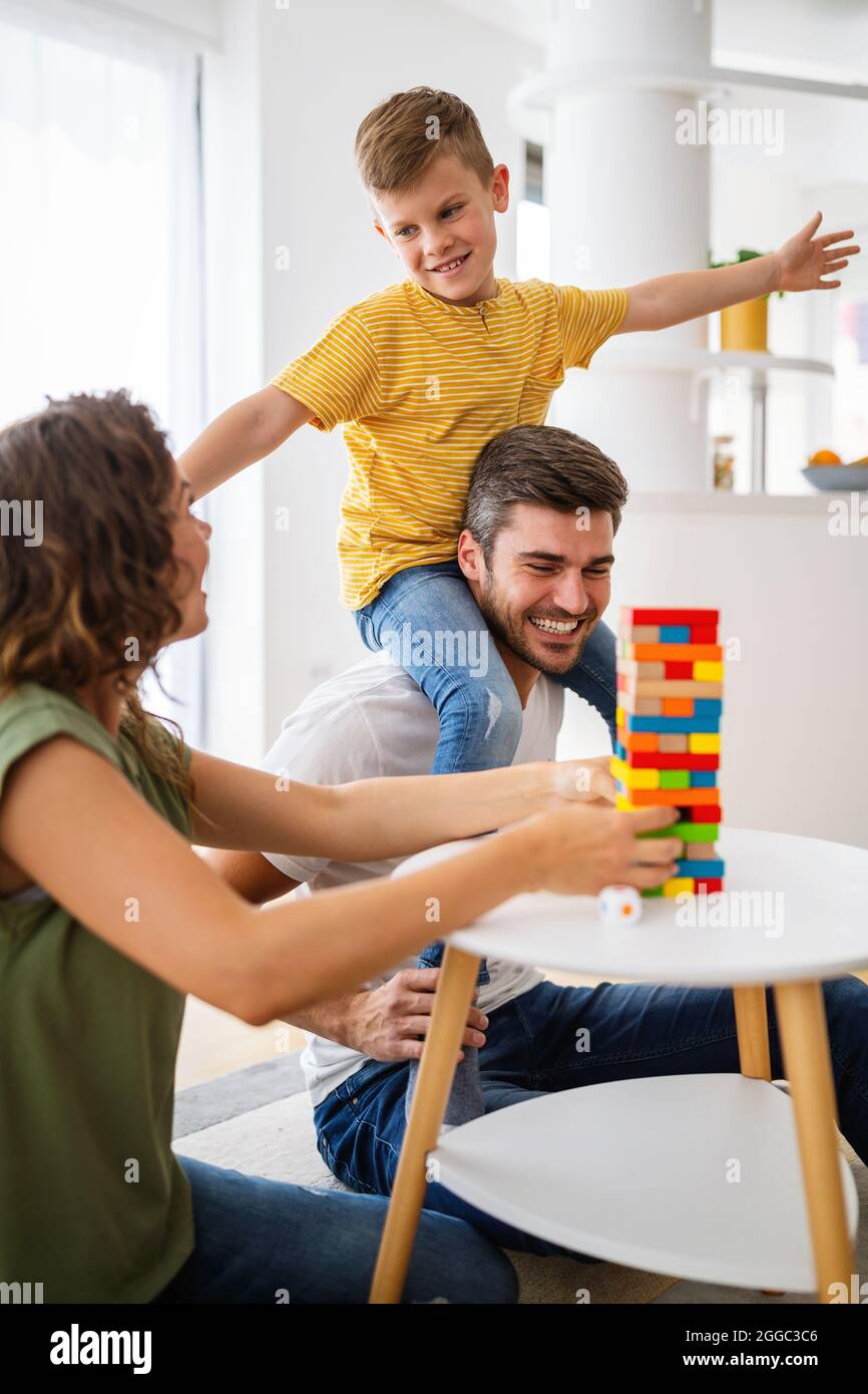 Young happy family having fun, playing together at home Stock Photo - Alamy