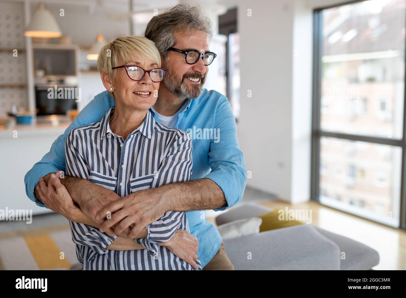 Happy Senior Couple In Love Hugging And Bonding With True Emotions At