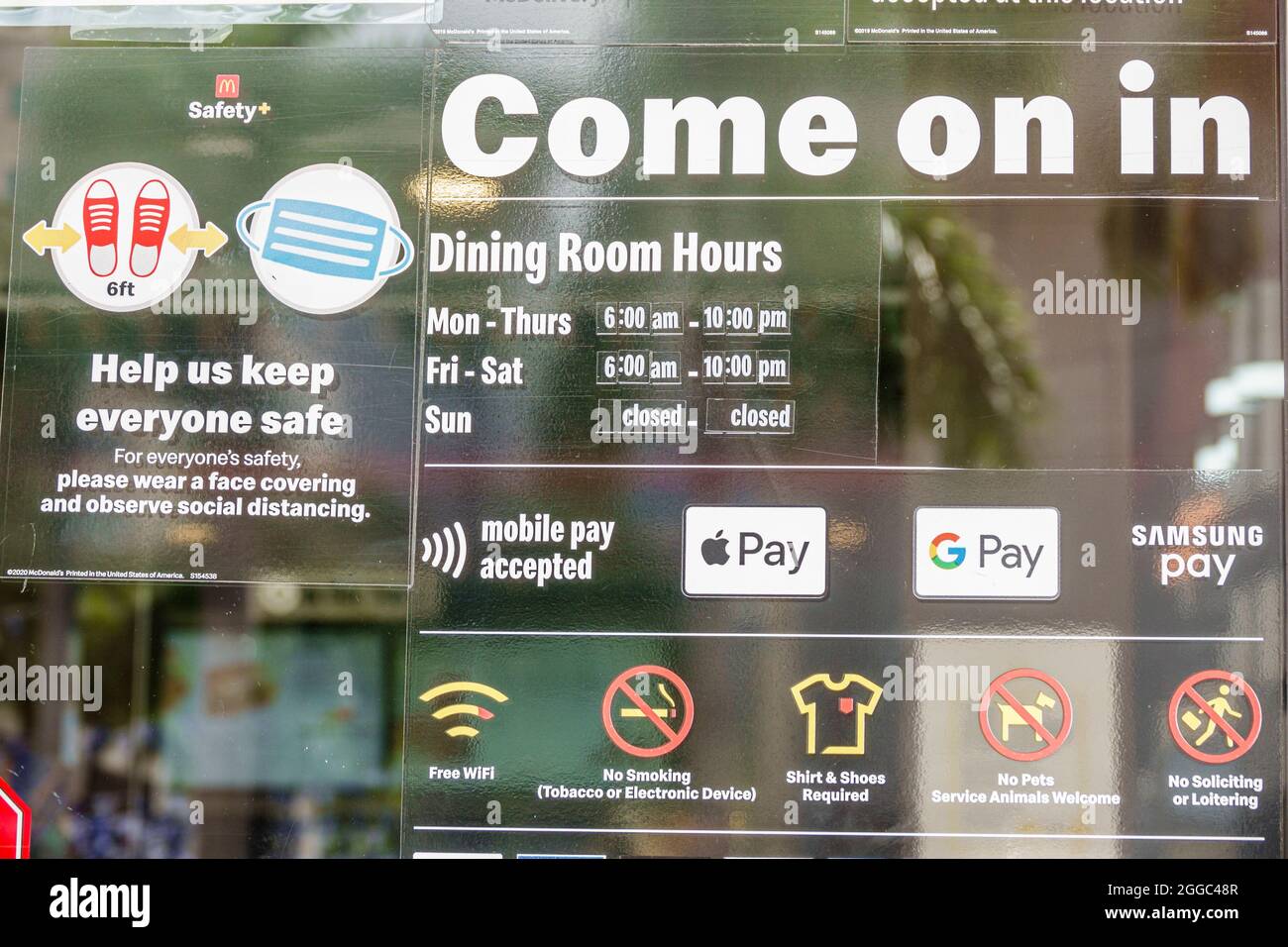 Miami Florida McDonalds restaurant entrance sign notice wear face ...