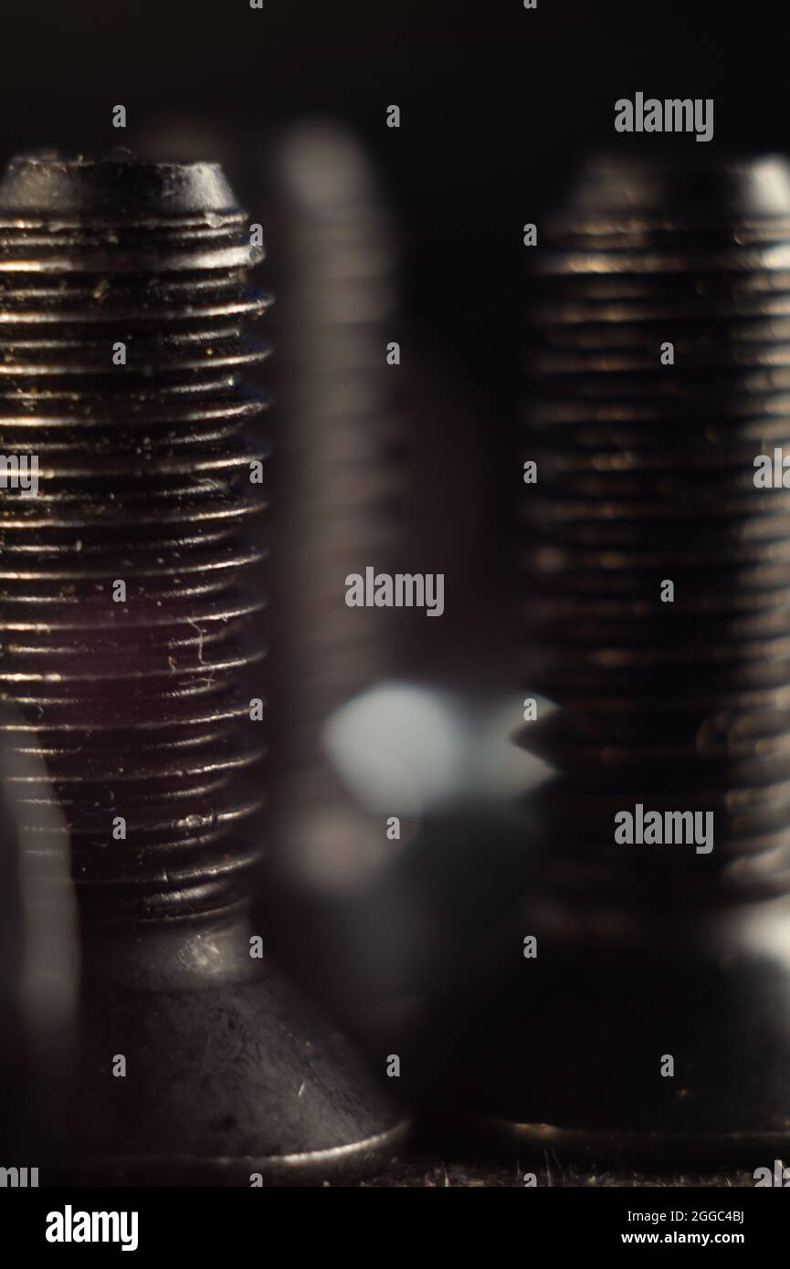 Vertical closeup shot of details on metallic nuts and bolts Stock Photo ...