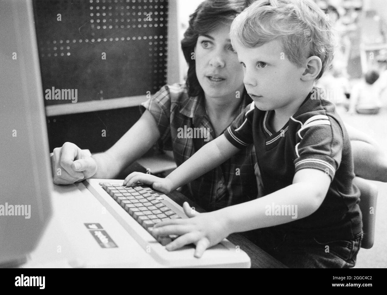 Austin Texas USA, circa 1989: Pre-school teacher works with little boy ...