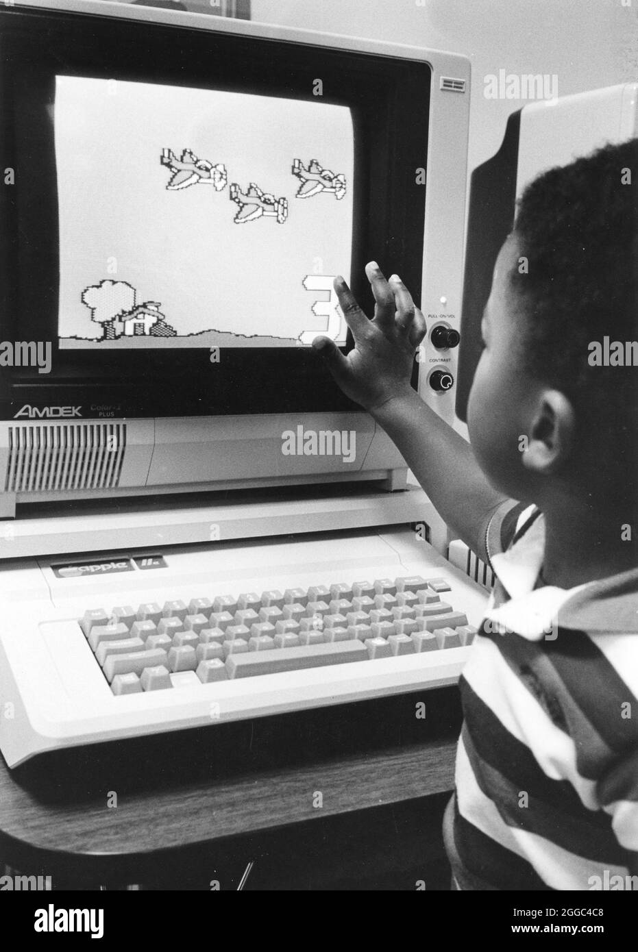 Austin Texas USA, 1989: Black boy day care computer center using Apple ...