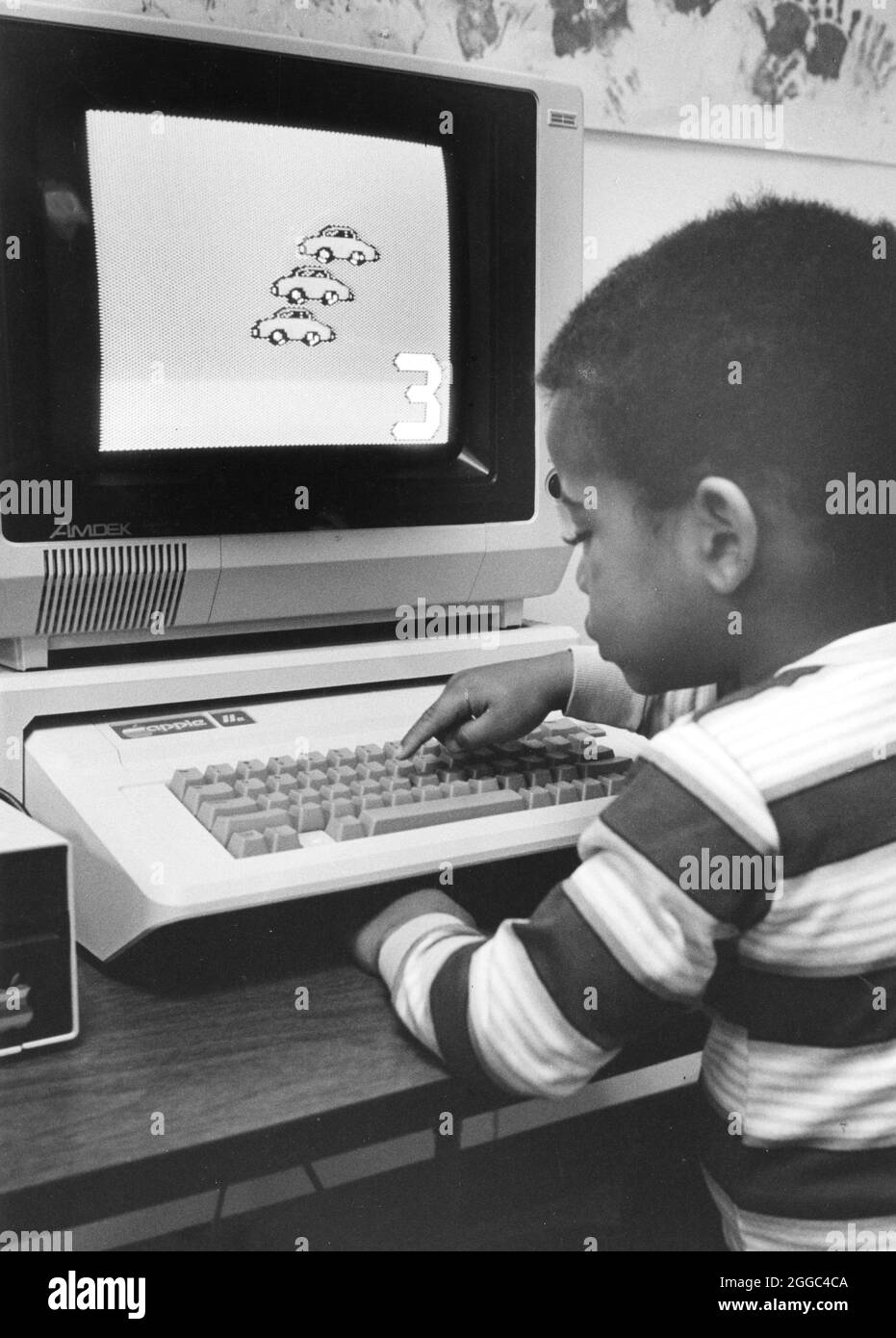 Austin Texas USA, 1989: Black boy day care computer center using Apple ...