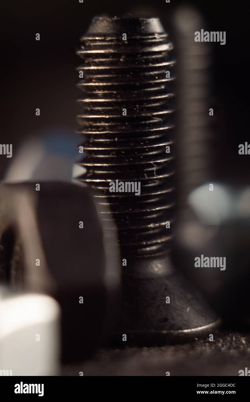 Vertical closeup shot of details on metallic nuts and bolts Stock Photo ...