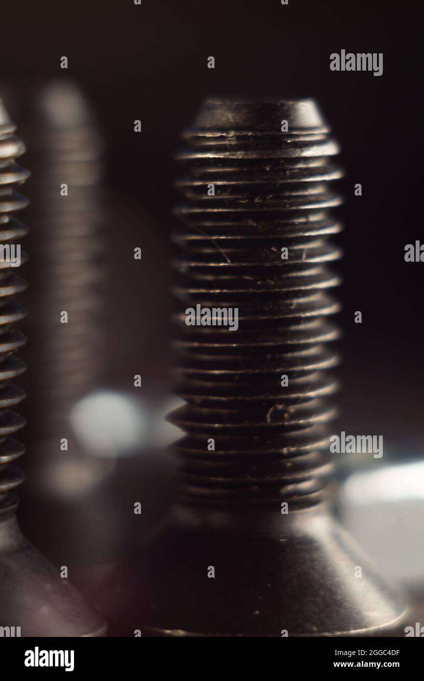 Vertical closeup shot of details on metallic nuts and bolts Stock Photo ...