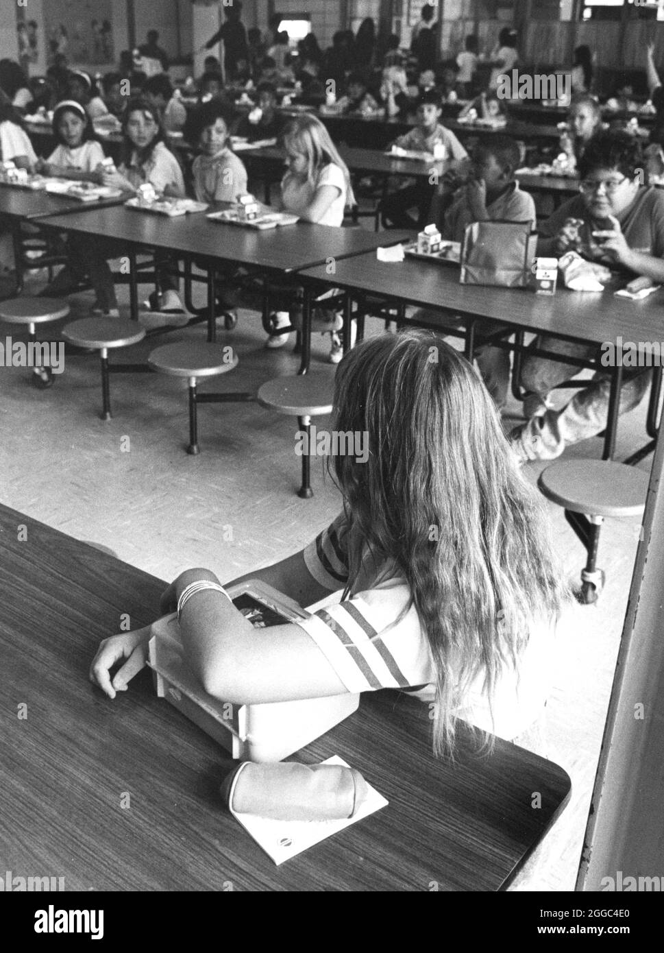 Austin Texas USA, 1990: Lonely 4th grade girl sits by herself in ...