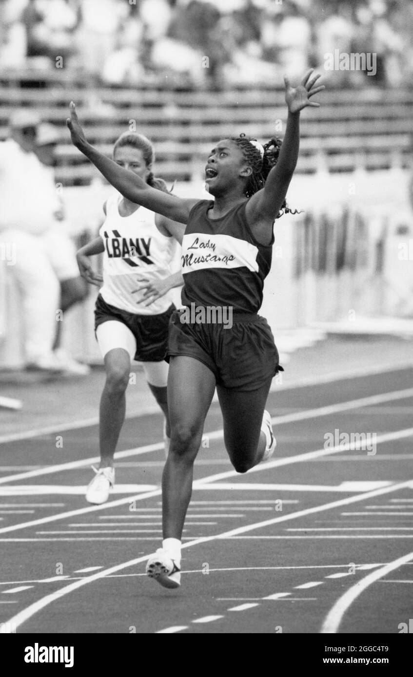 Austin, Texas USA, circa 1992: African-American girl exults as the ...