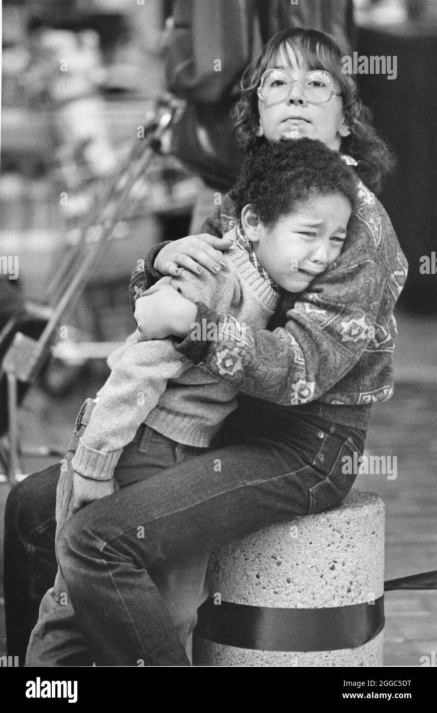 Austin Texas USA, circa 1992: Woman comforts crying child who was ...
