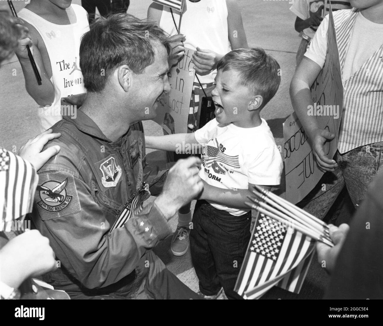 Austin Texas USA, 1991: Young boy squeals in delight as he greets his ...