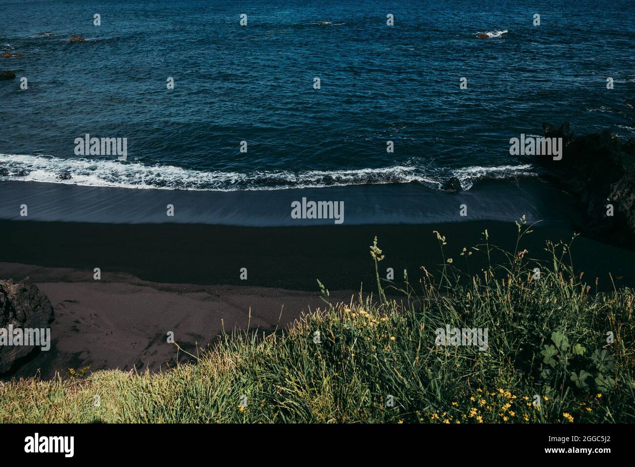 View of sea waves rushing into the sandy shor Stock Photo - Alamy