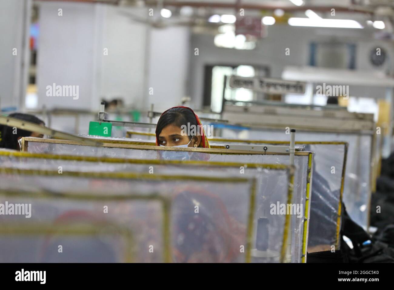 Non Exclusive: Women workers wear face masks as preventive measure ...