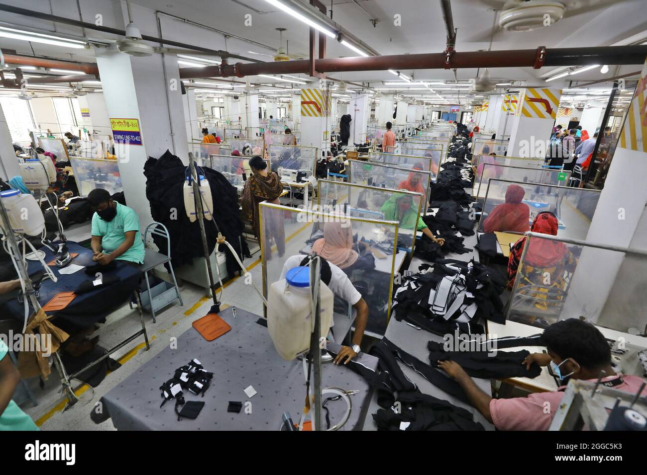 Non Exclusive: Women workers wear face masks as preventive measure ...