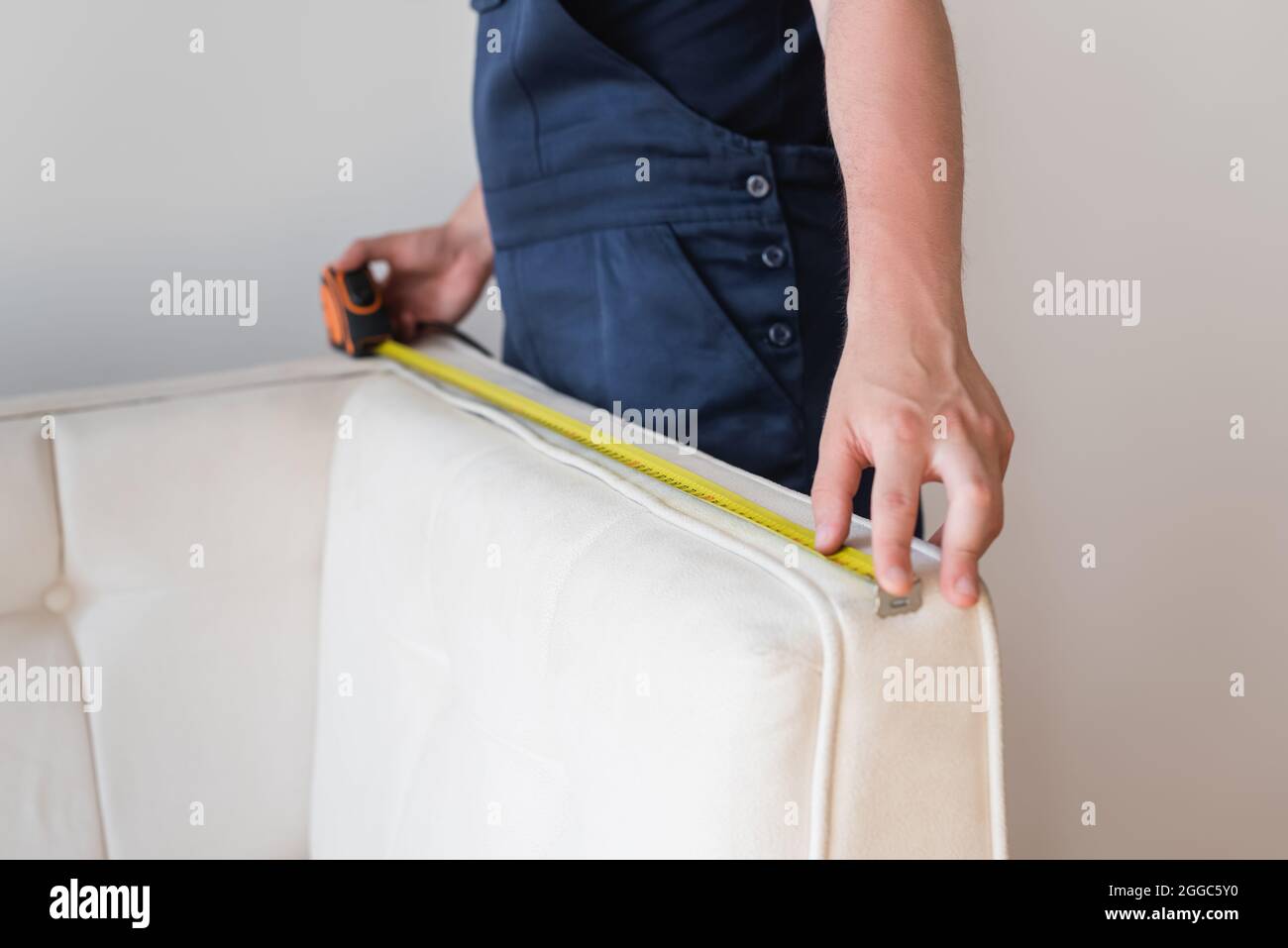 Handyman measuring white furniture hi-res stock photography and images ...