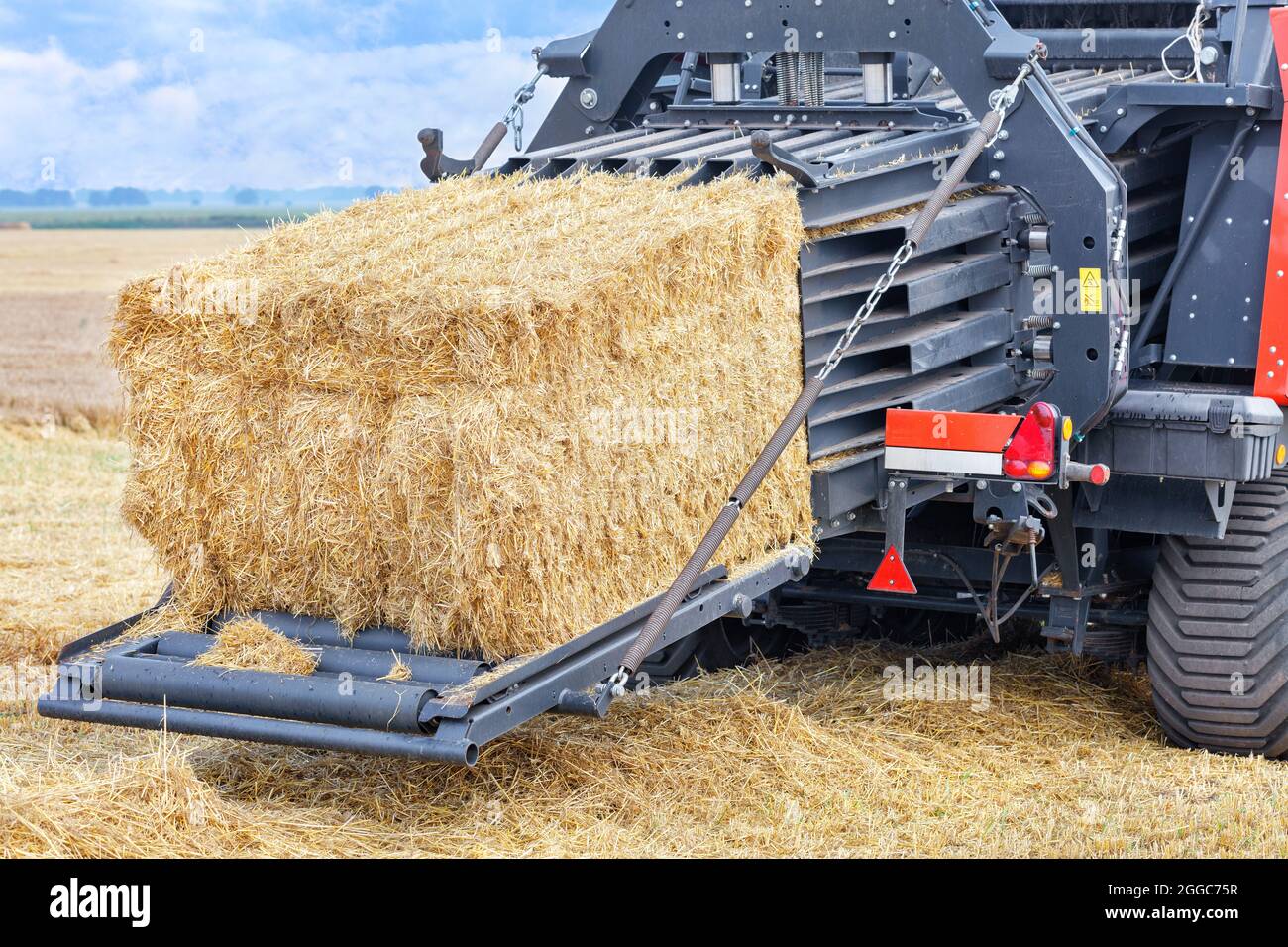 The process of harvesting grain in an agricultural field, forming ...