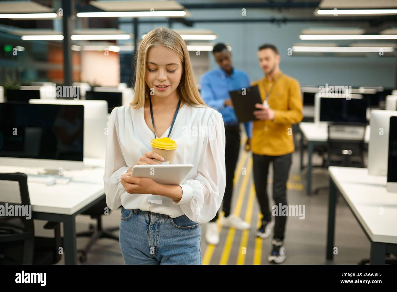 Female manager holds laptop hi-res stock photography and images - Alamy