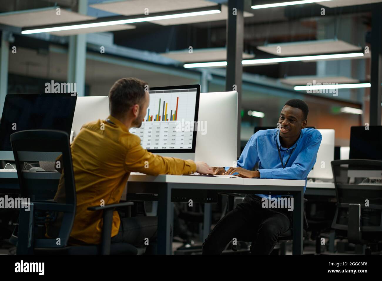 Employees works on computers, workplace in office Stock Photo - Alamy