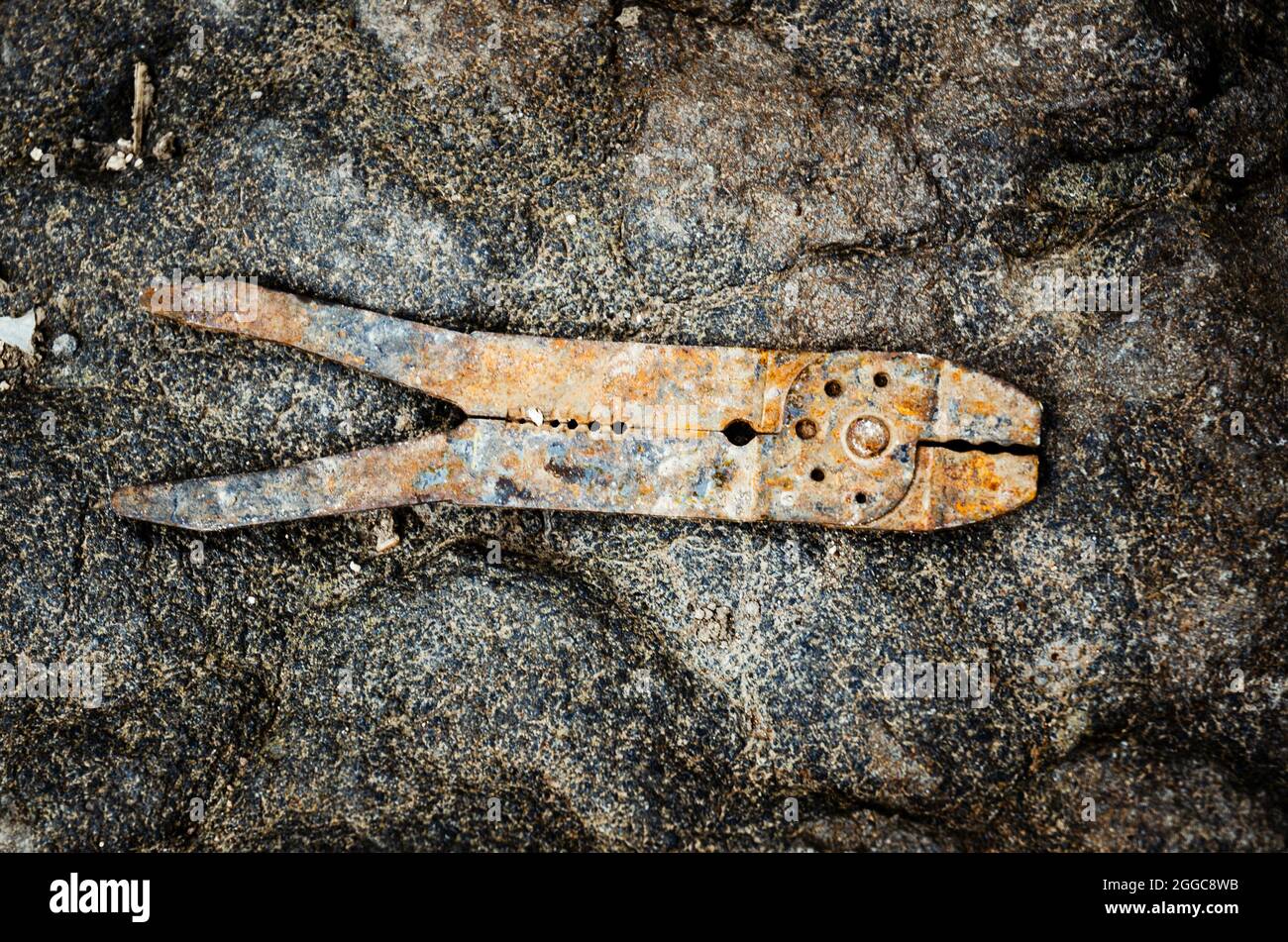 Top view of old, rusty nippers on a stone surface Stock Photo - Alamy