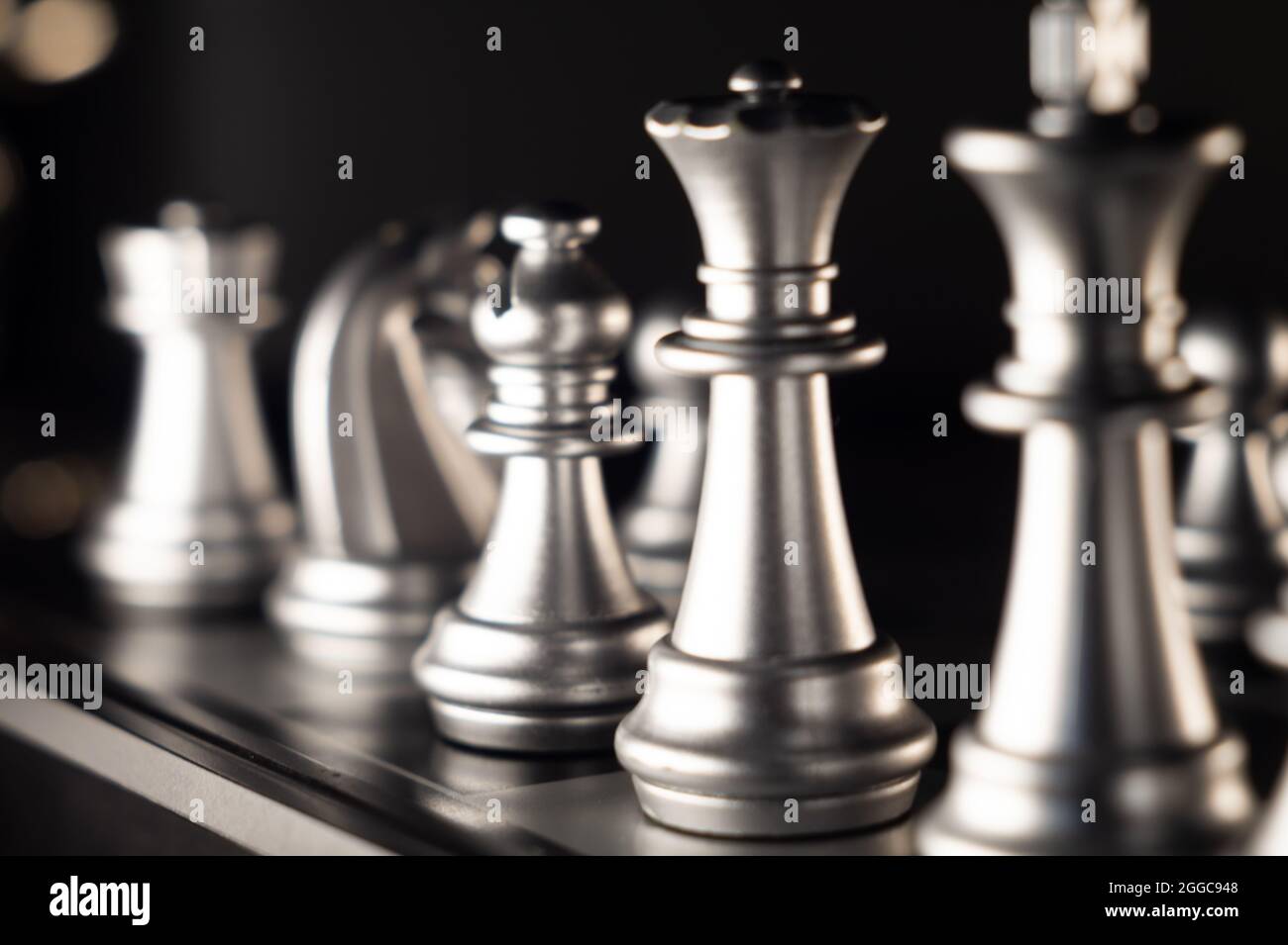 Closeup shot of a shiny metallic arranged chess board Stock Photo - Alamy