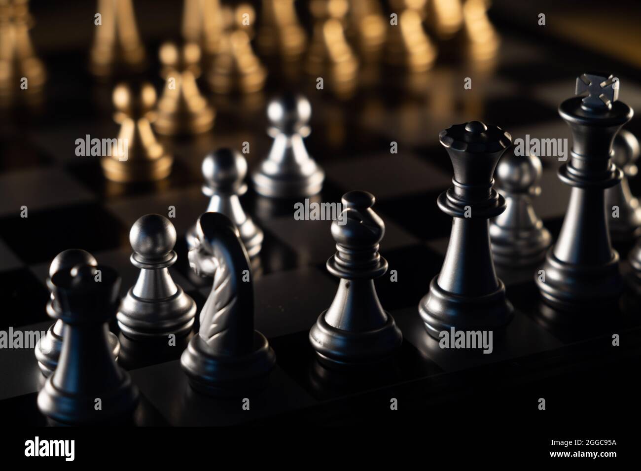Closeup shot of a shiny metallic arranged chess board Stock Photo - Alamy