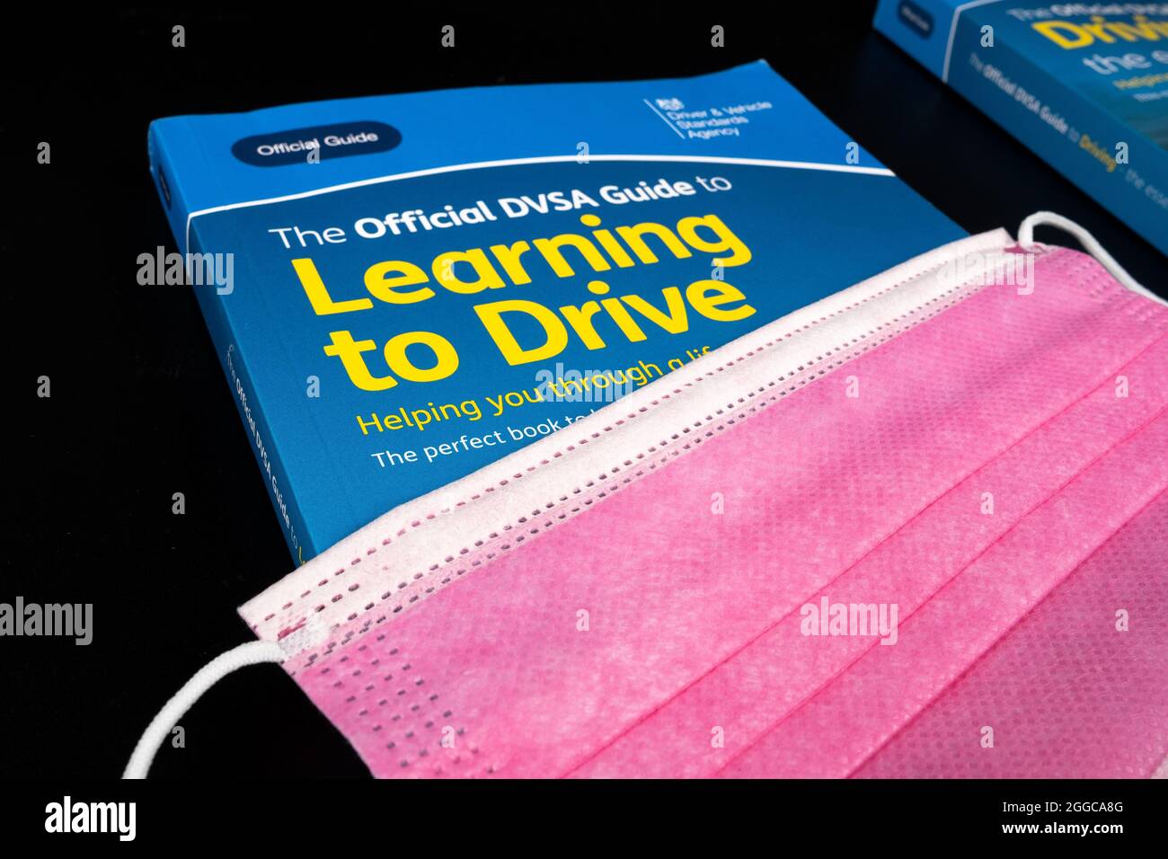 Viral face mask on top of The Official Highway Code, Official DVSA ...