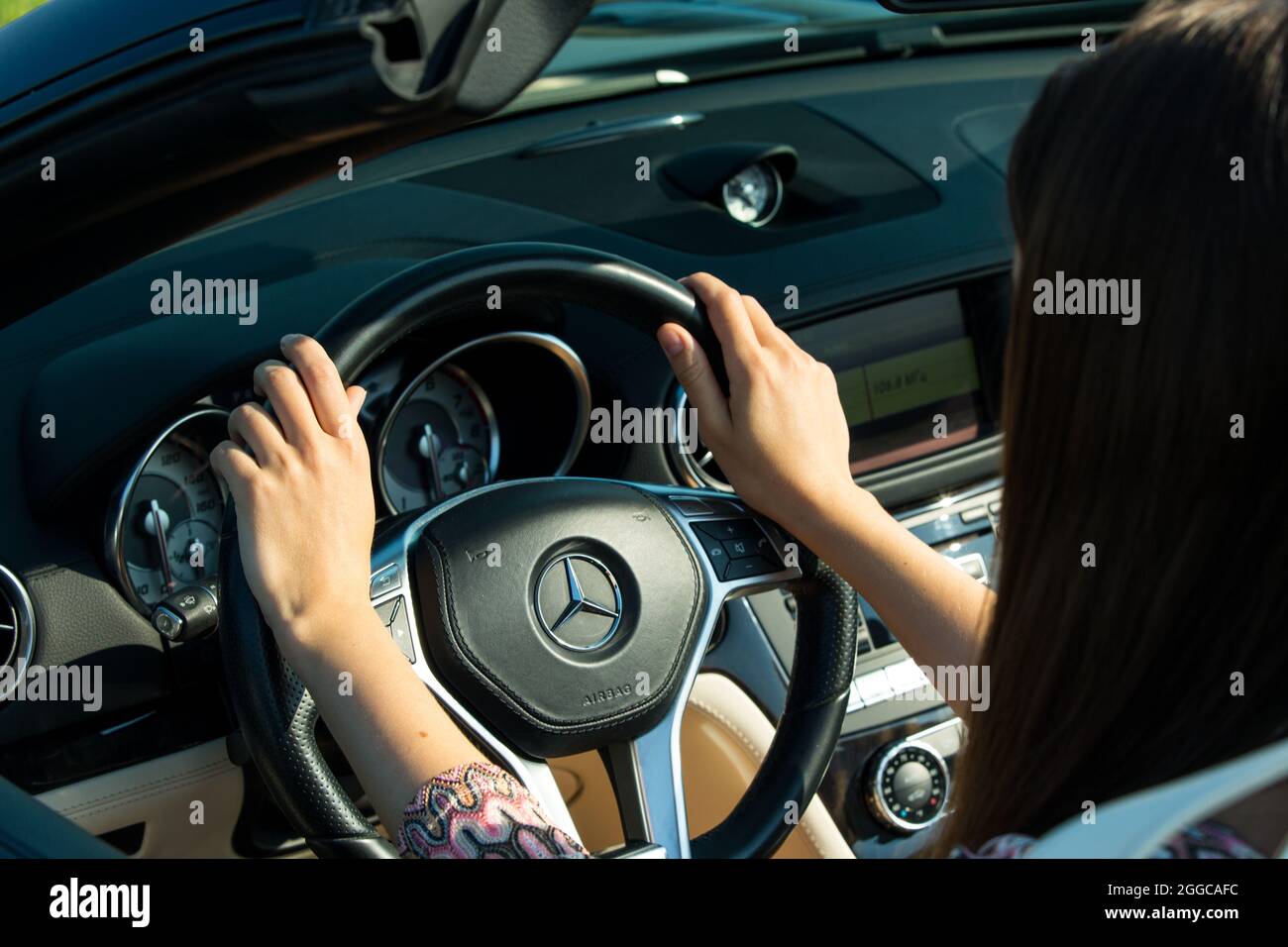 Dnepropetrovsk, Ukraine - 08.24.2021: Closeup on female hands driving ...