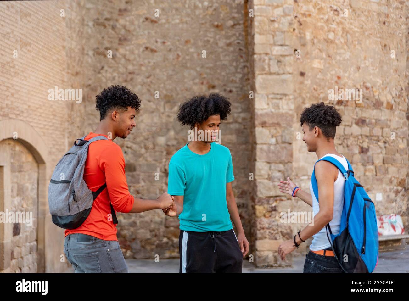 Group of multiethnic friends meeting in the city Stock Photo - Alamy