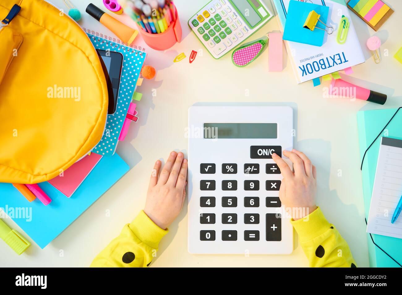 Back to school. Upper view of modern child with workbooks, stationary ...