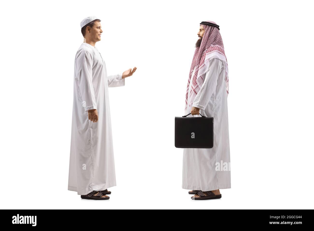 Full length profile shot of an arab man talking to a saudi arab ...