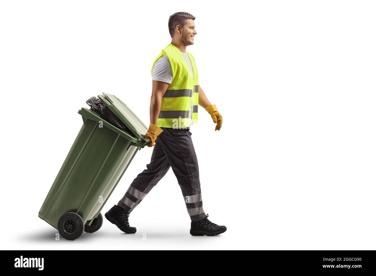 Bin man walking and pulling a green plastic bin isolated on white ...