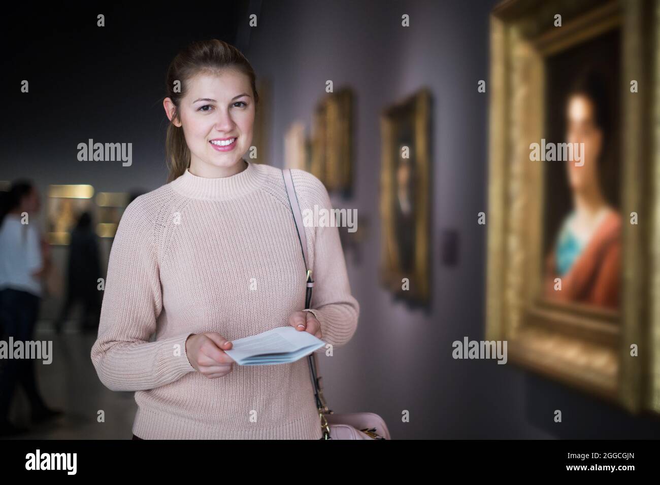Woman at exhibition in museum Stock Photo - Alamy