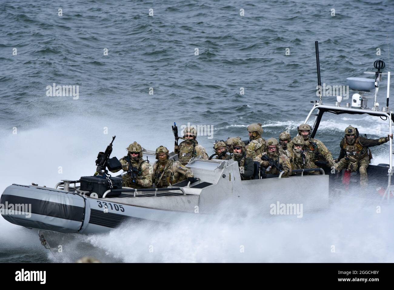 U.S. Coast Guard Maritime Security Response Team West members stand ...