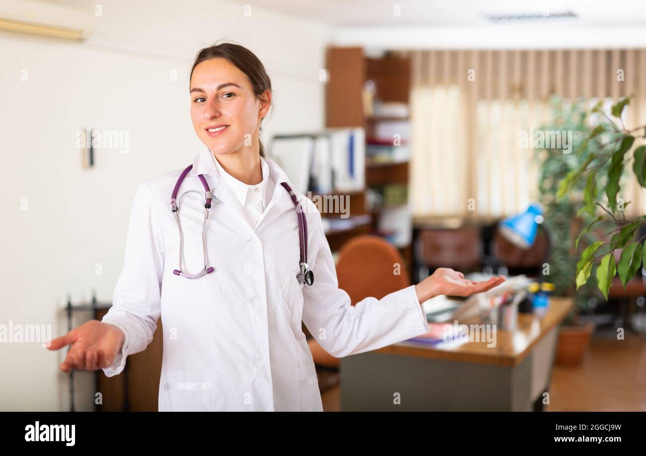 Positive female doctor posing in private clinic Stock Photo - Alamy