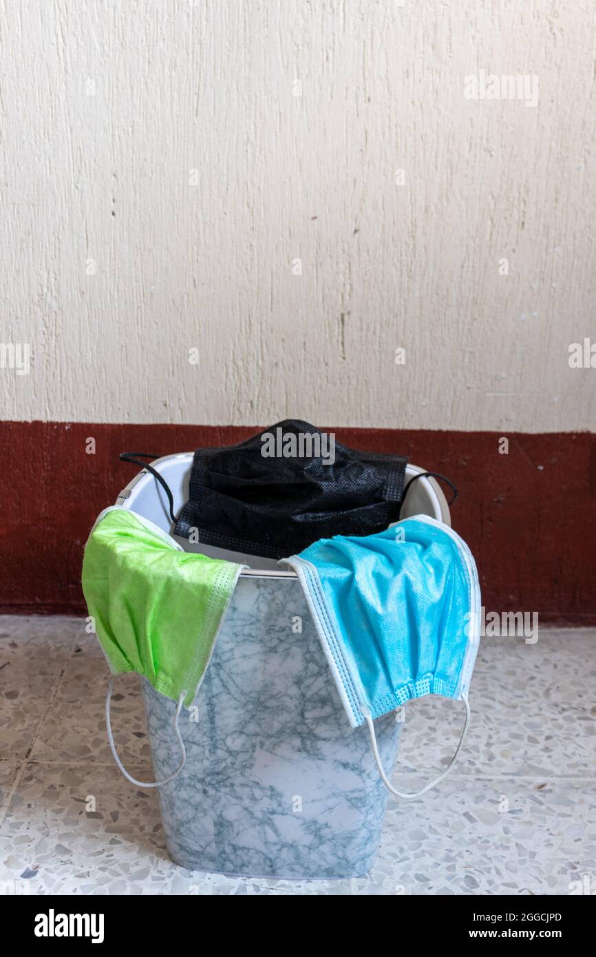 face mask inside a garbage can , end of pandemic concept Stock Photo ...