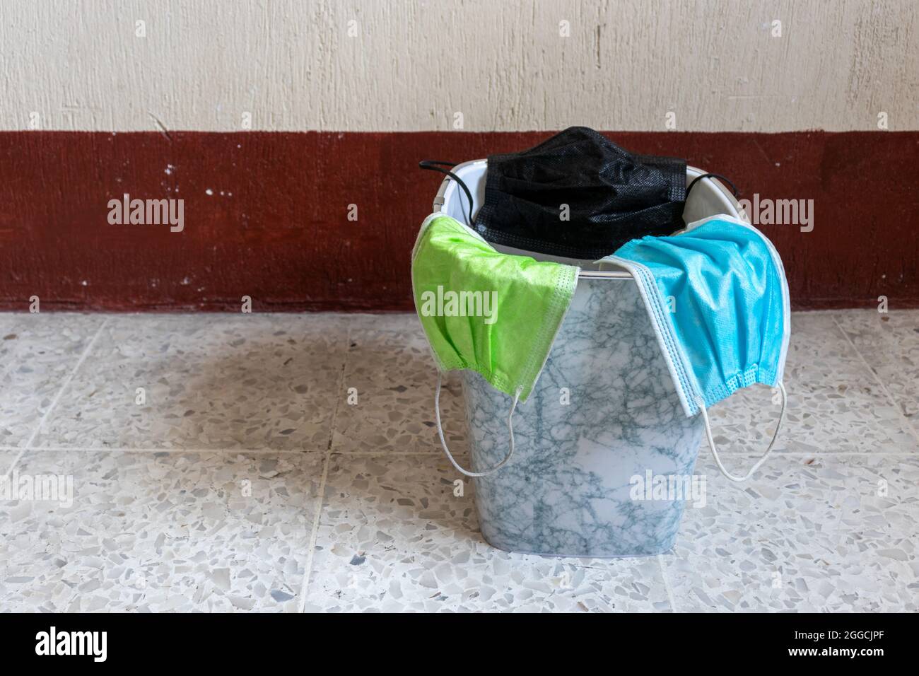 face mask inside a garbage can , end of pandemic concept Stock Photo ...